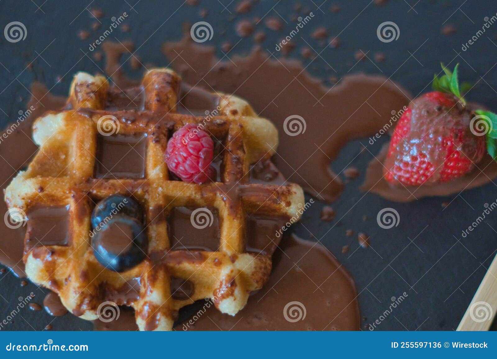 Top View of a Single Waffle with Chocolate, Berries and a Spoon on the ...