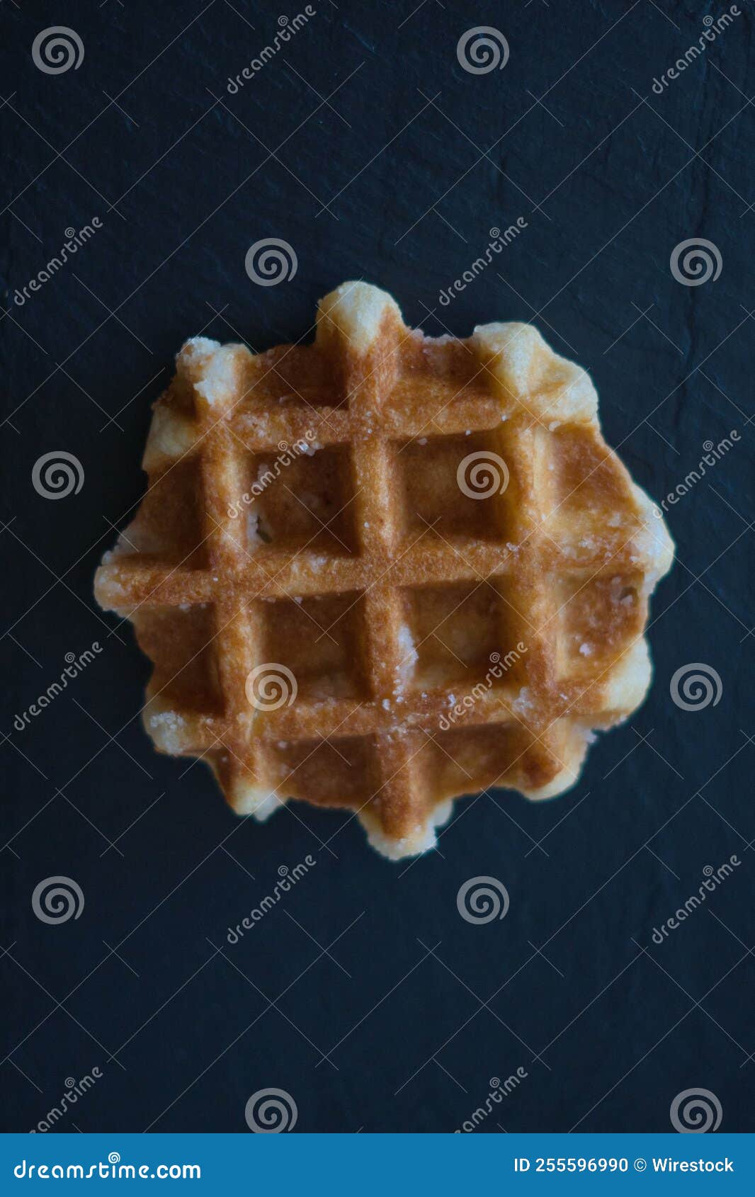 Top View of a Single Waffle Isolated on the Blue Background Stock Photo ...