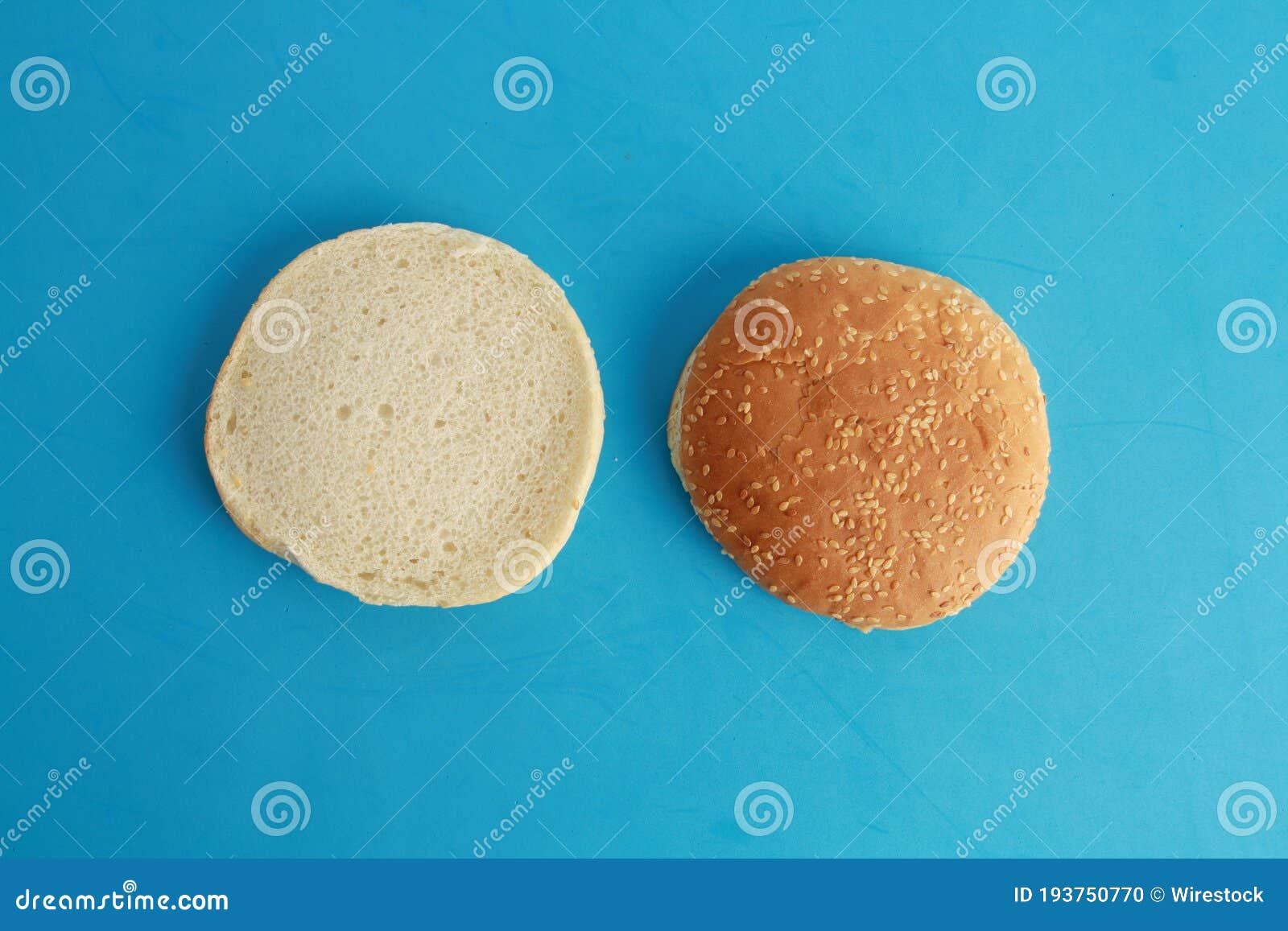 Top View of a Sliced Hamburger Bun on a Blue Surface Stock Photo ...