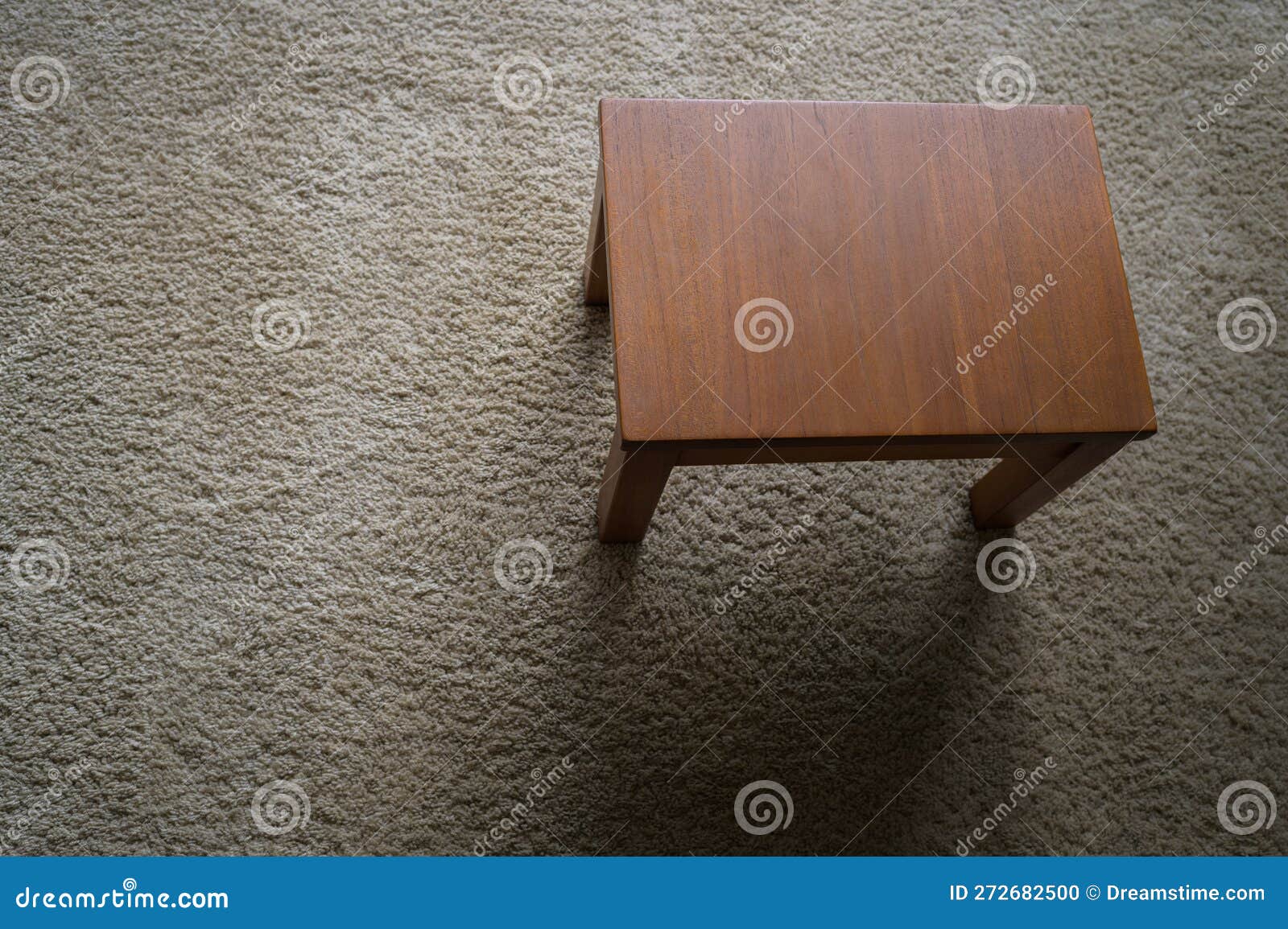 Top View of Small Teak Table on Beige Carpet. Stock Photo - Image of ...