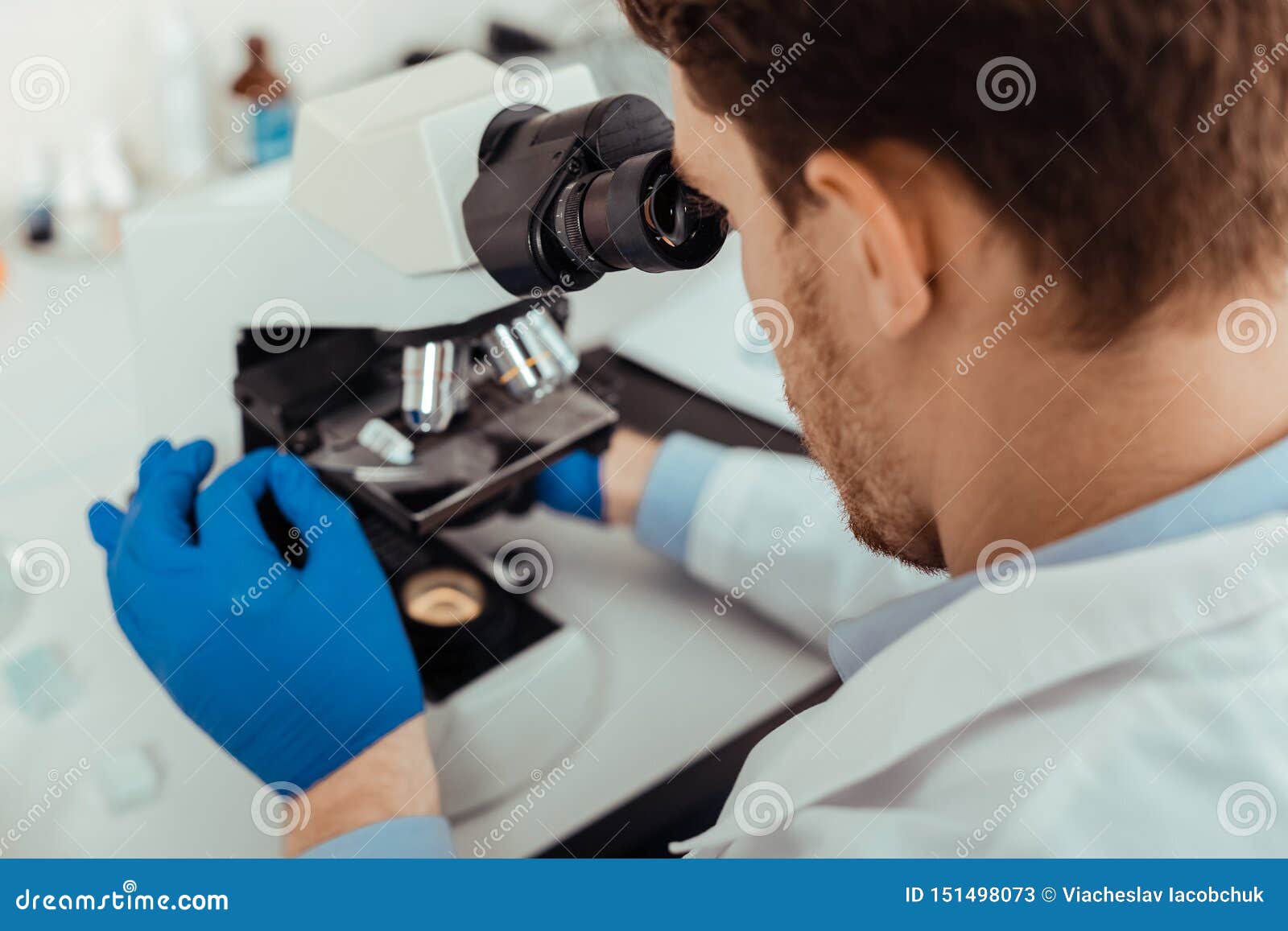 Top View of a Smart Man Looking into the Microscope Stock Image - Image ...