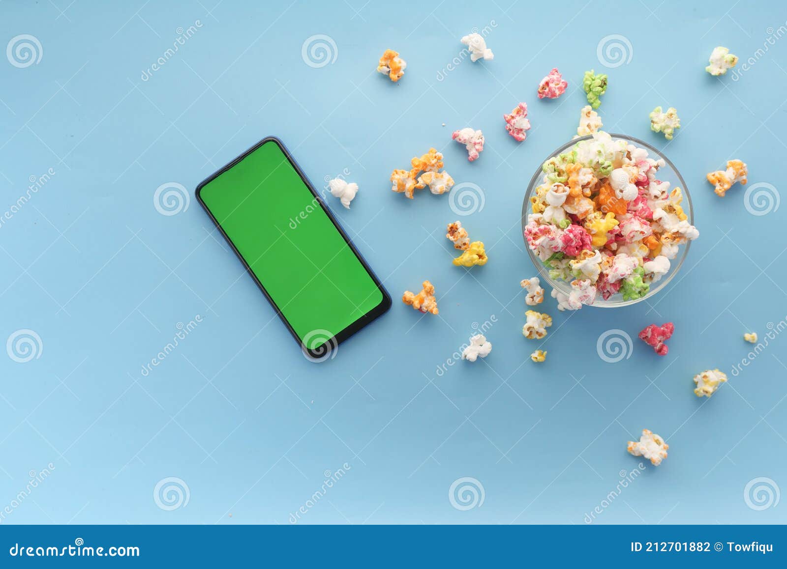 Top View of Smart Phone and Popcorn on Blue Background Stock Photo ...