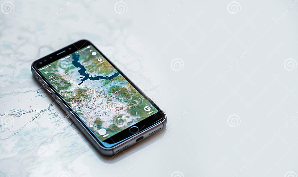 Top View of Smartphone Lying on a Map Use for Navigate or GPS. Copy ...