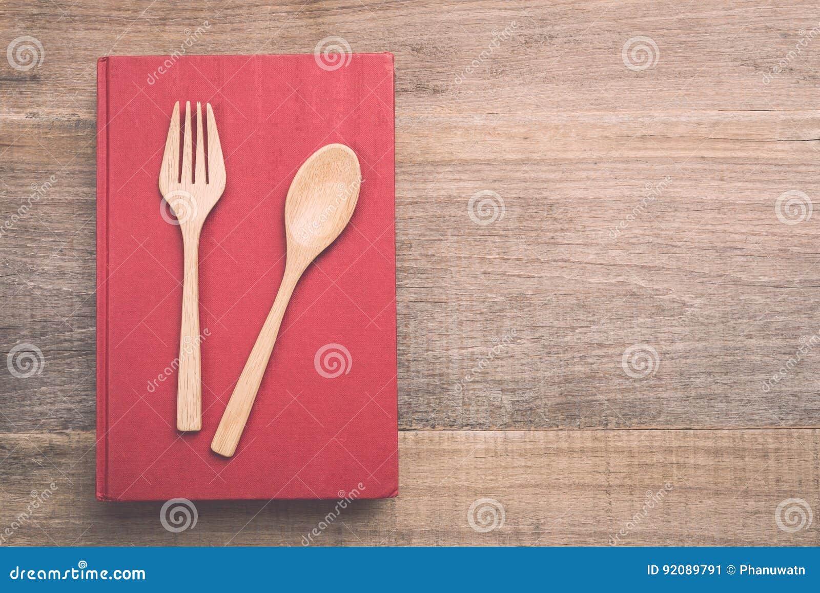 Top View Spoon, Fork And Book On Wooden Plank Background Royalty-Free ...
