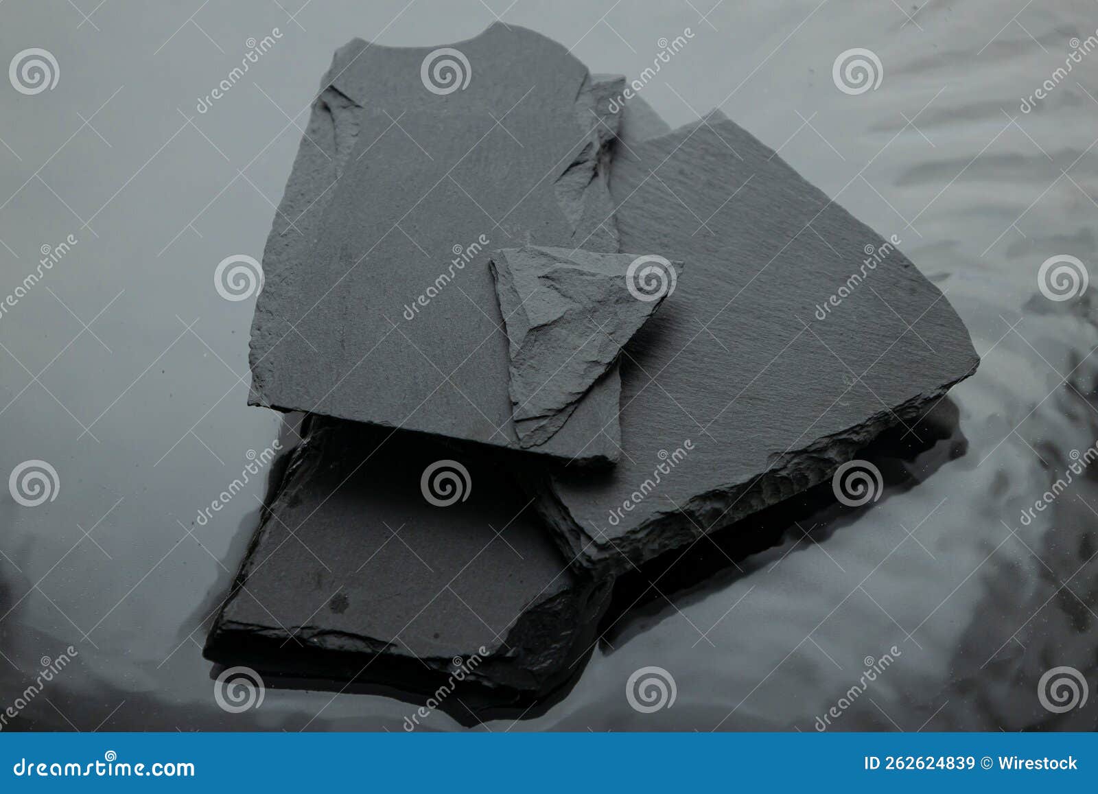 Top View of Stack of Flat Black Natural Stones on Gray Surface Stock ...