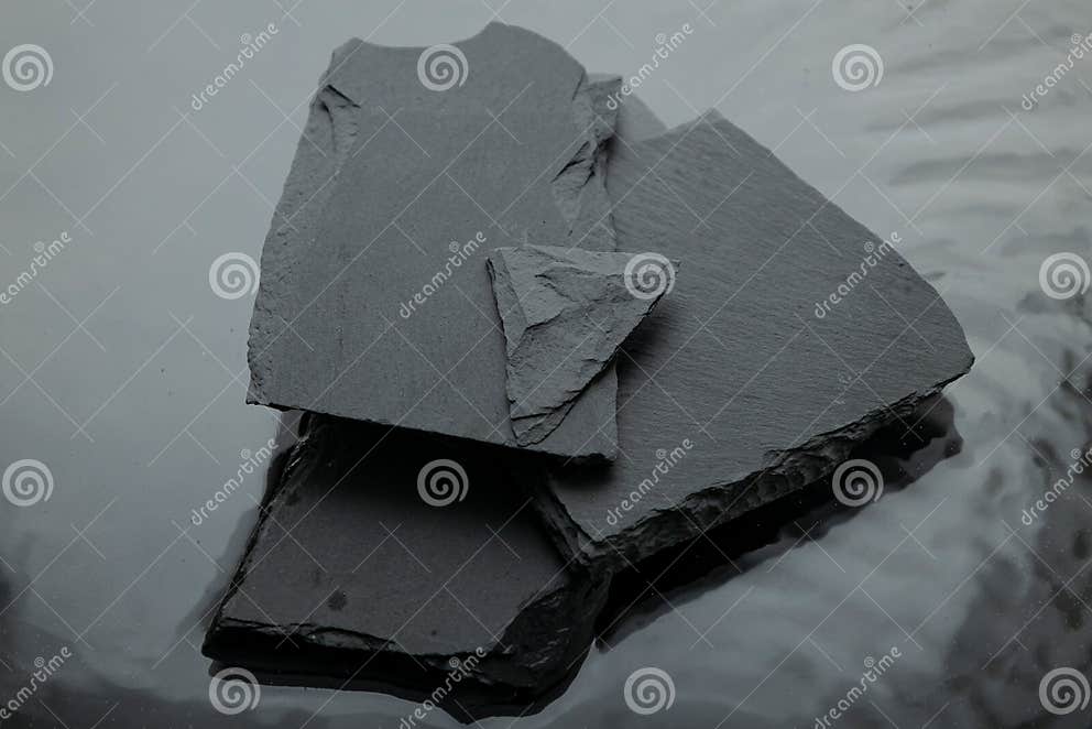 Top View of Stack of Flat Black Natural Stones on Gray Surface Stock ...
