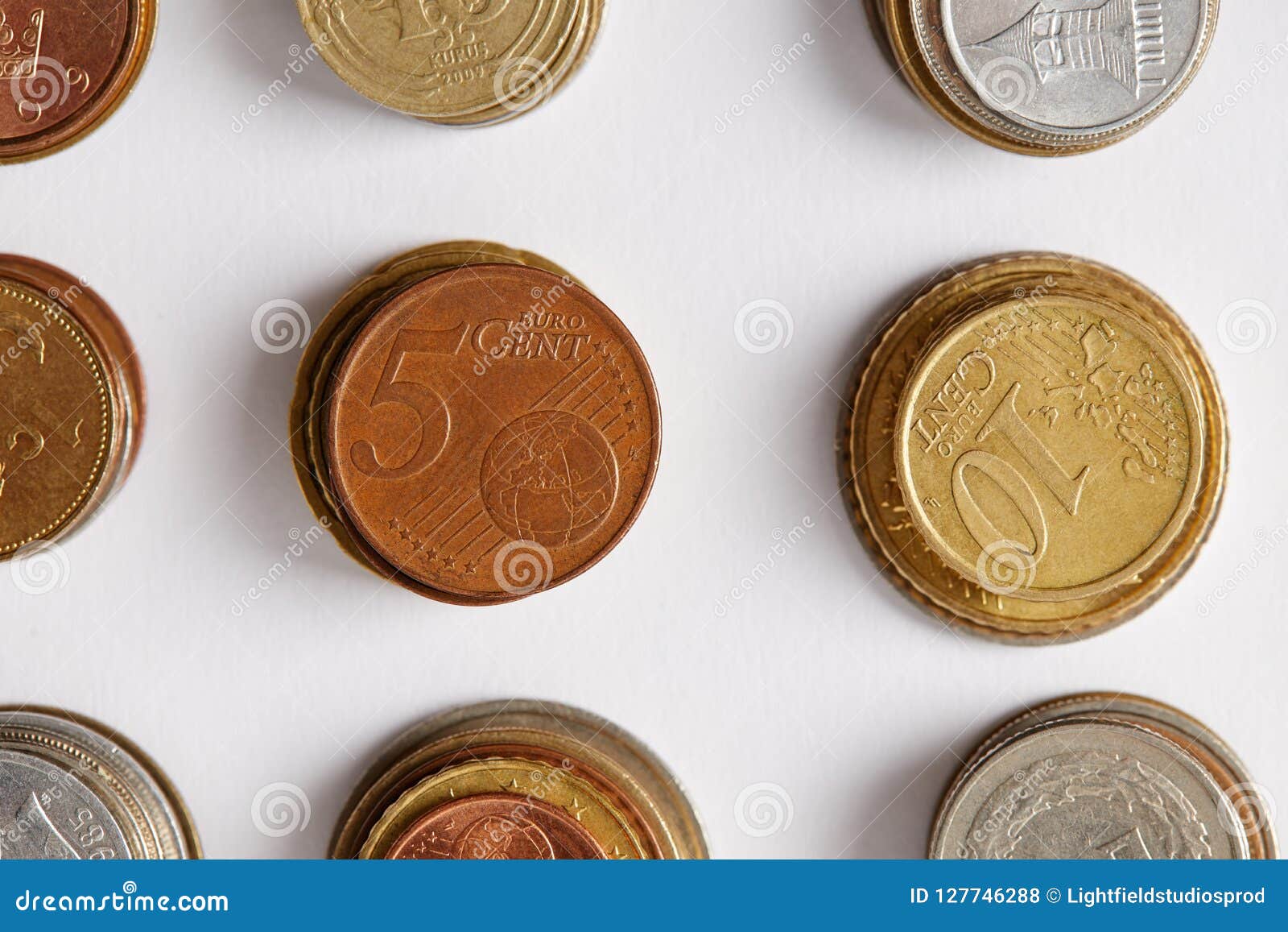 Top View of Stacks of Various Coins on White Stock Photo - Image of ...