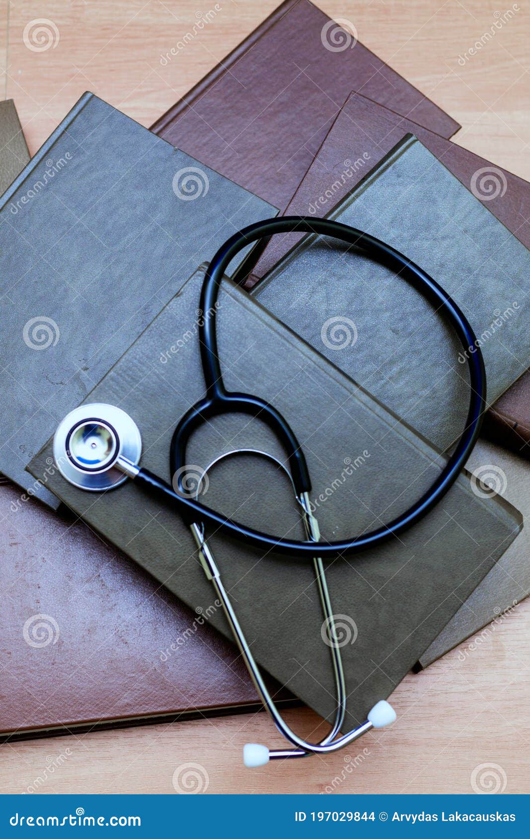 Top View Stethoscope with Stack of Books on Table.Medical Literature ...