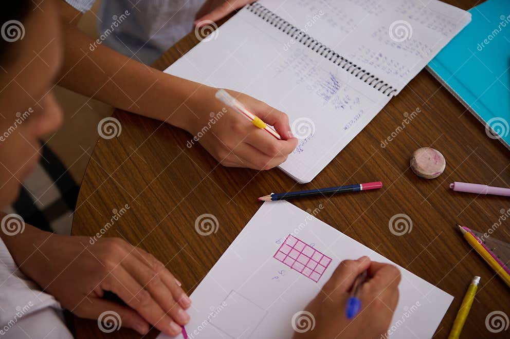 Students Collaborating on Math Homework at a Wooden Table Stock Image ...