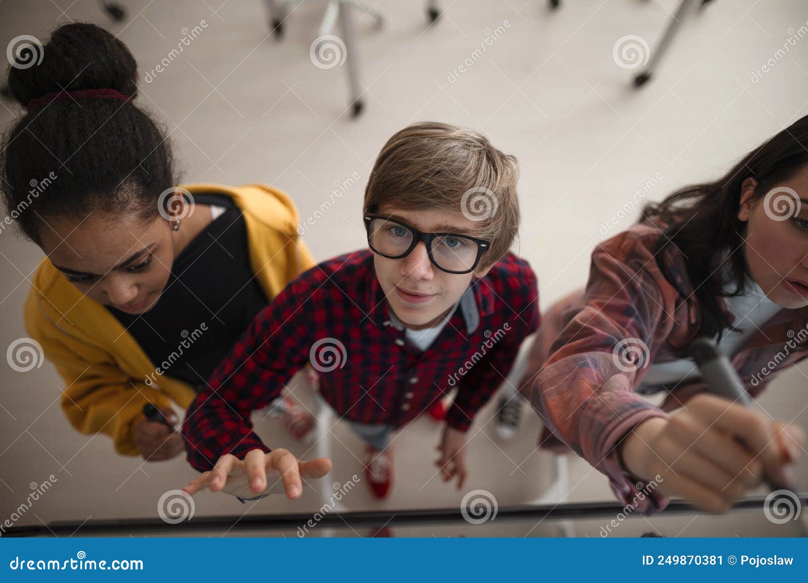 Top View of Students Writing at Board in School Class. Stock Image ...