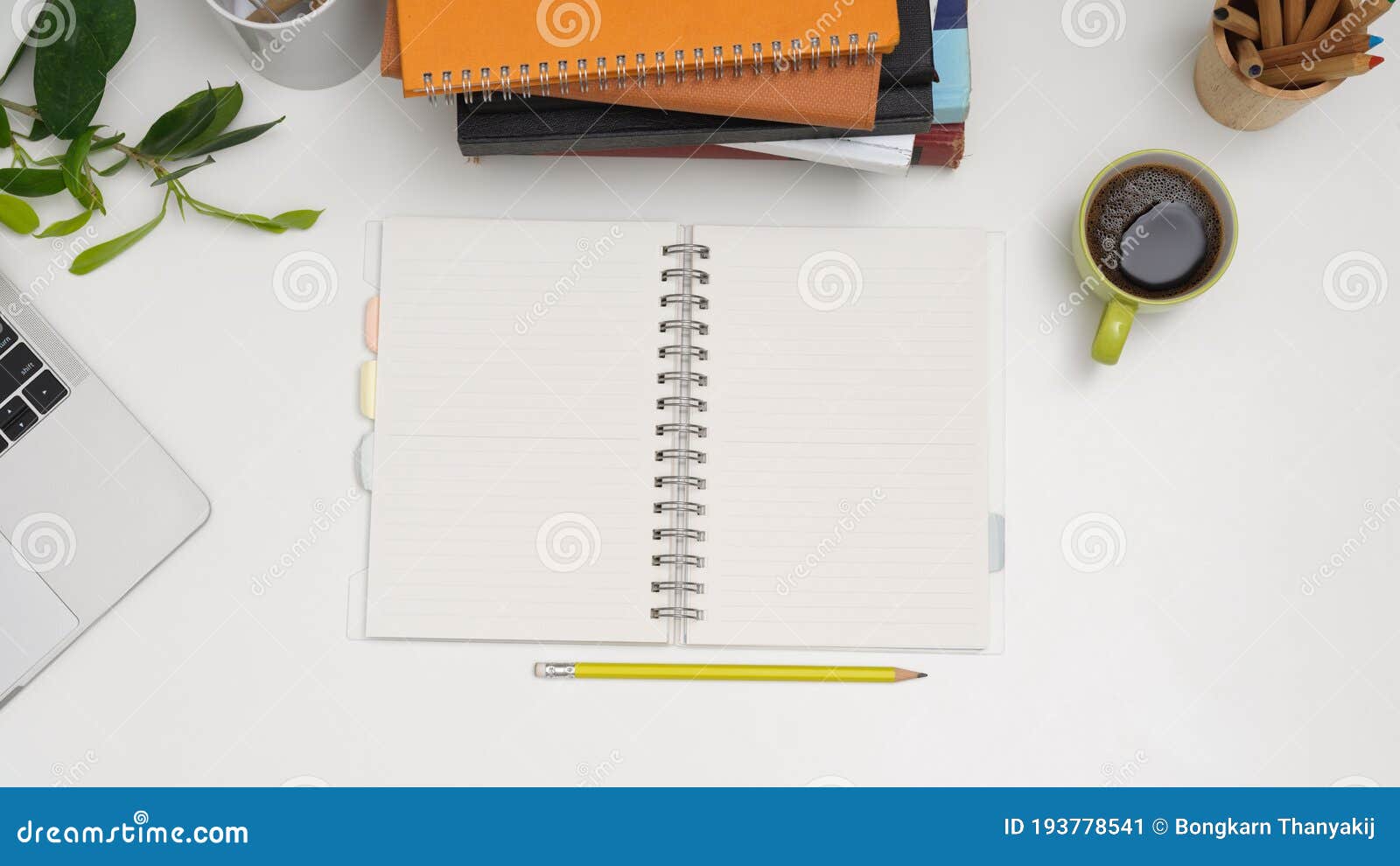 Study Table with Opened Blank Notebook, Laptop, Stack of Books, Pencils ...