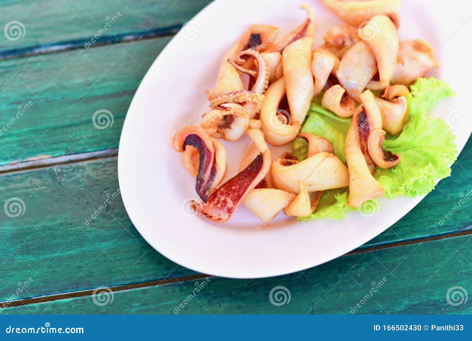 Top View of Sun Dried Squids on Plate Stock Photo - Image of table ...