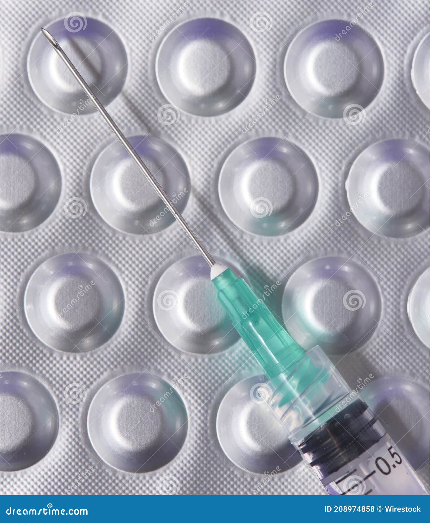 Top View of a Syringe Needle on a Tablet Pack Under the Light Stock ...