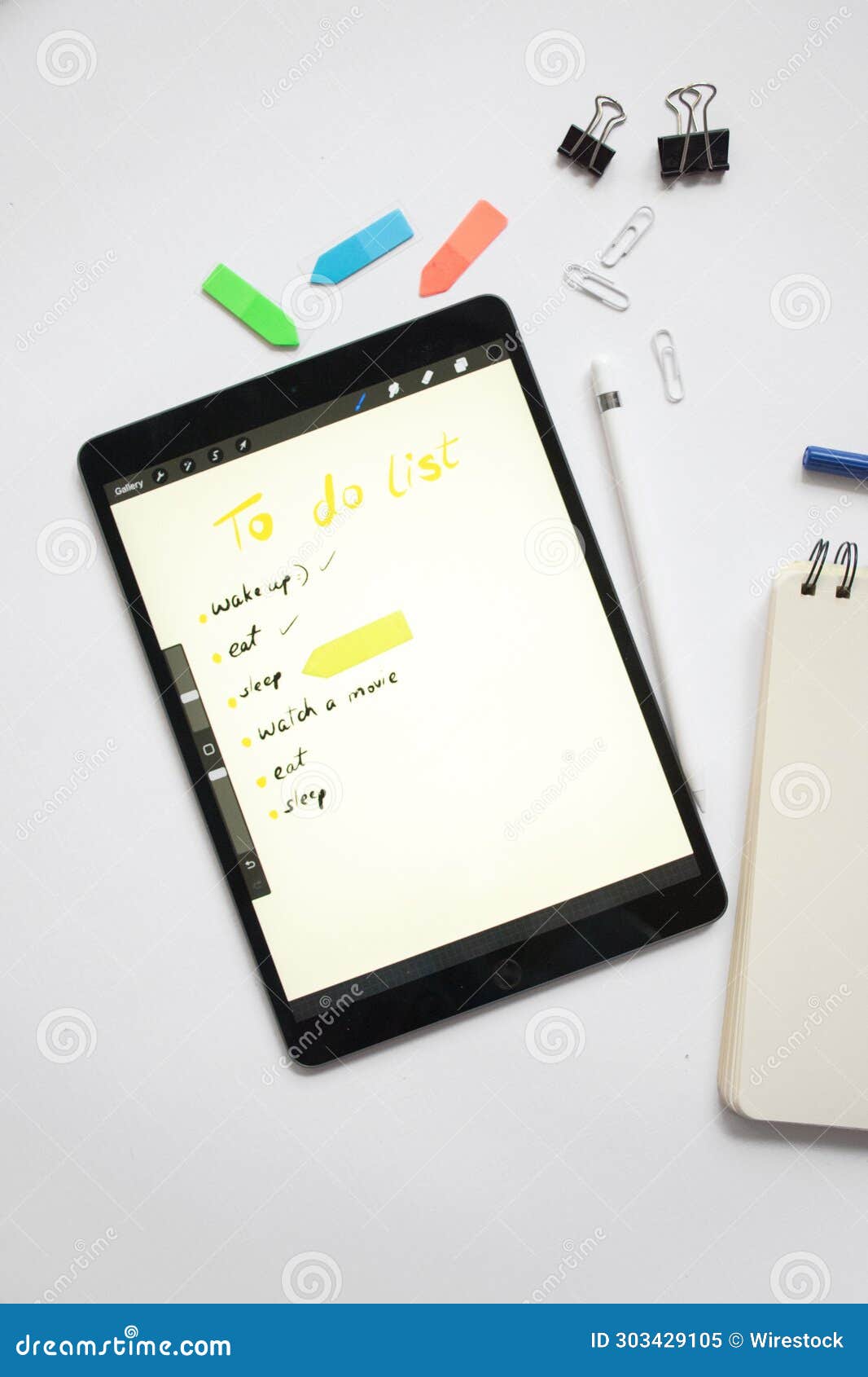 Top View of a Tablet with a "to-do List" on the Screen with Stationery ...