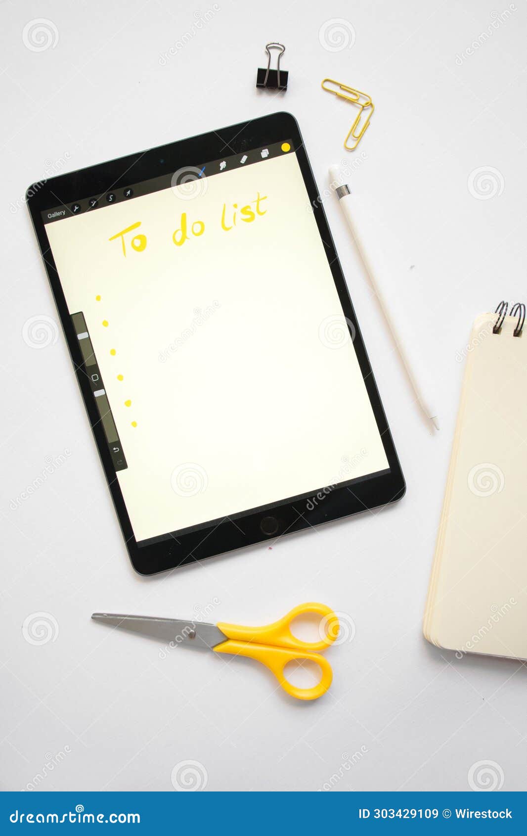Top View of a Tablet with a "to-do List" on the Screen with Stationery ...