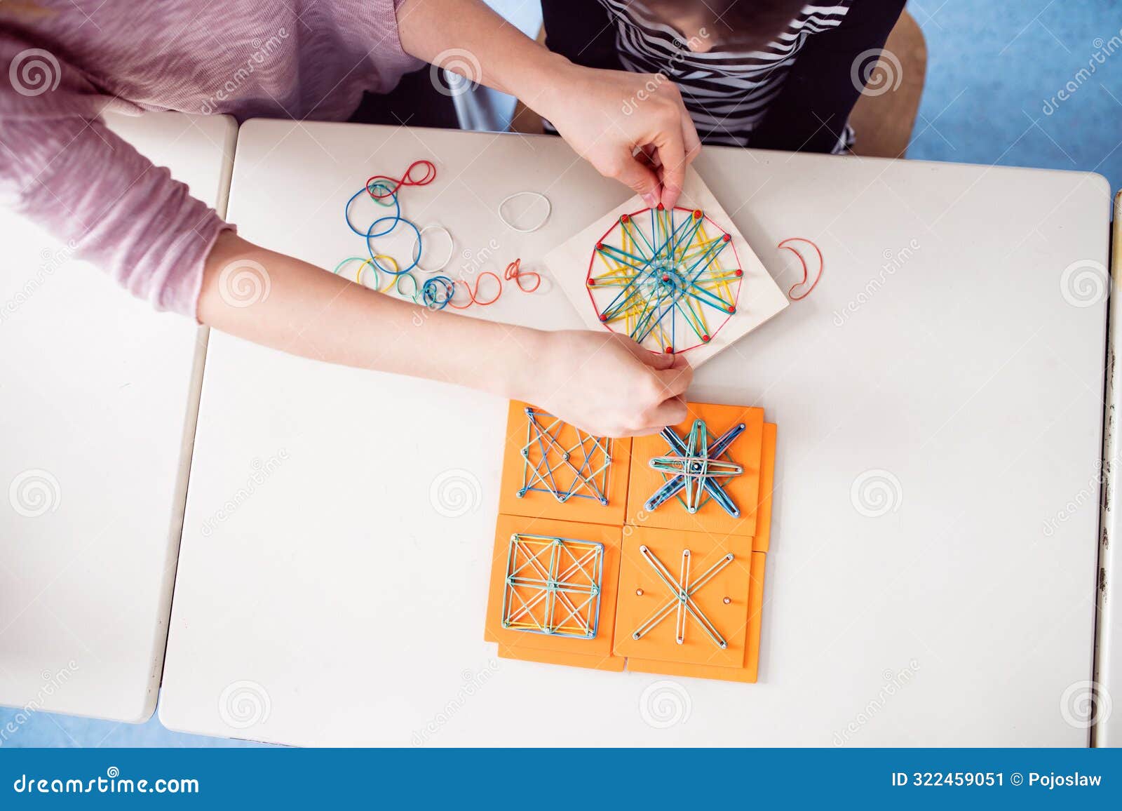 Top View of Teacher Using Geoboard in Class, Teaching Students ...