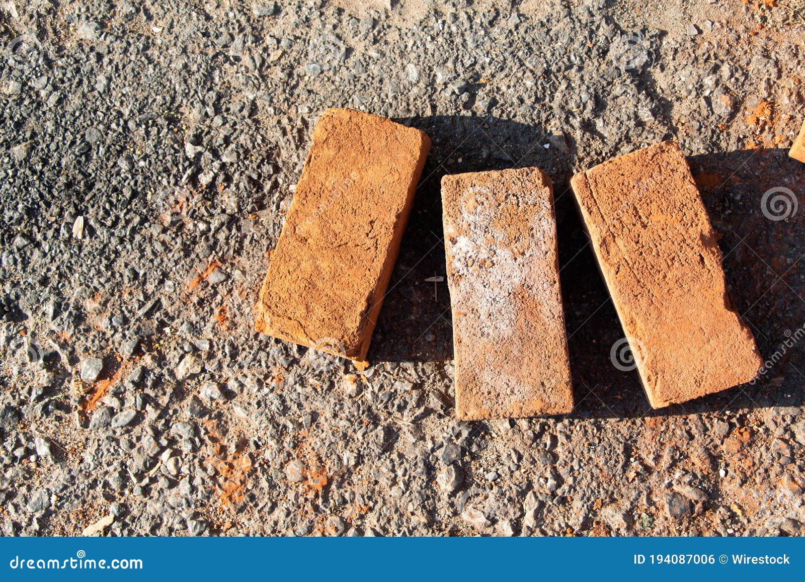 Top View of Three Bricks on a Gray Stone Floor Stock Photo - Image of ...