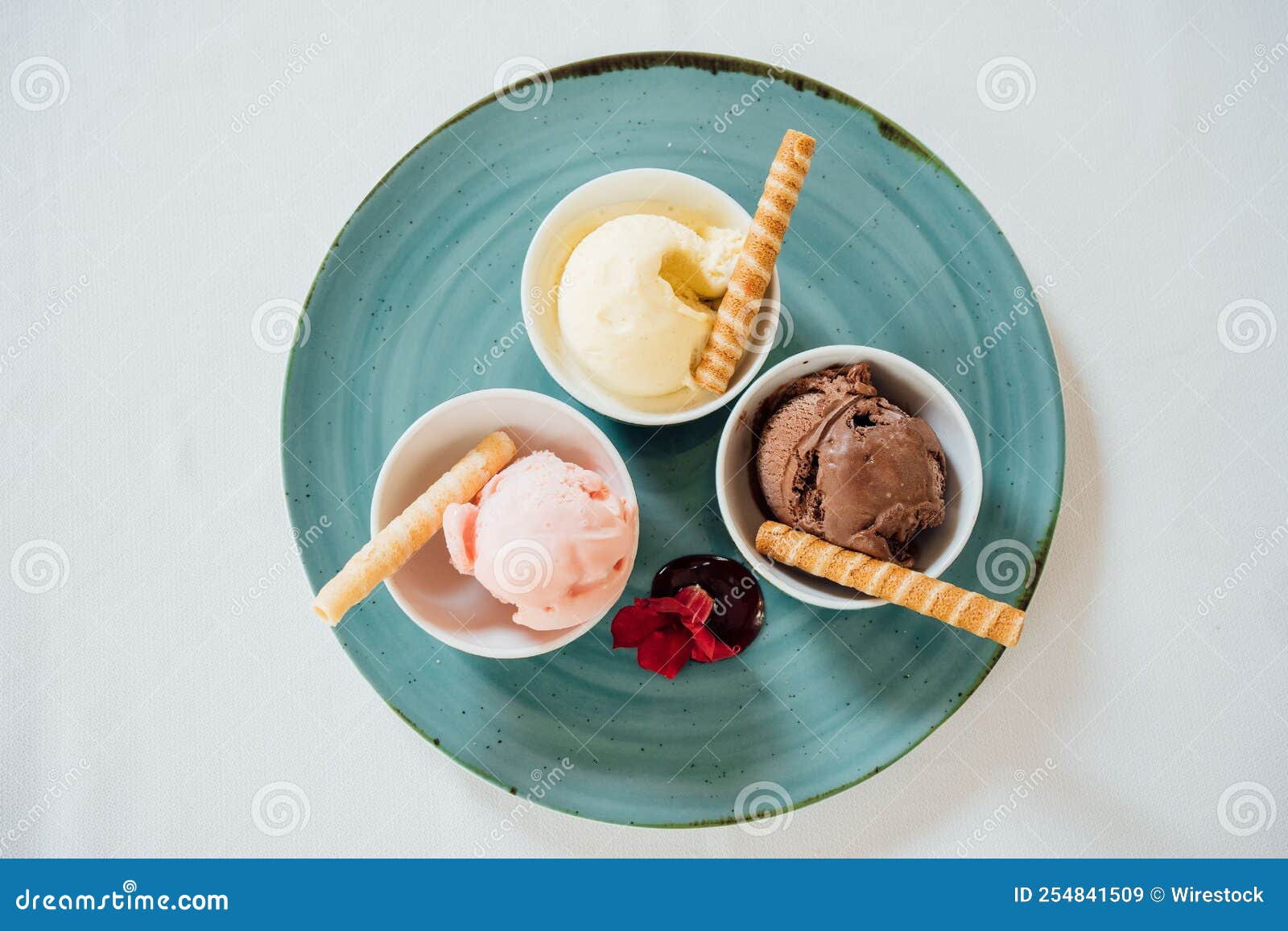 Top View of Three Ice Creams in Bowls Served on the Blue Plate Stock ...