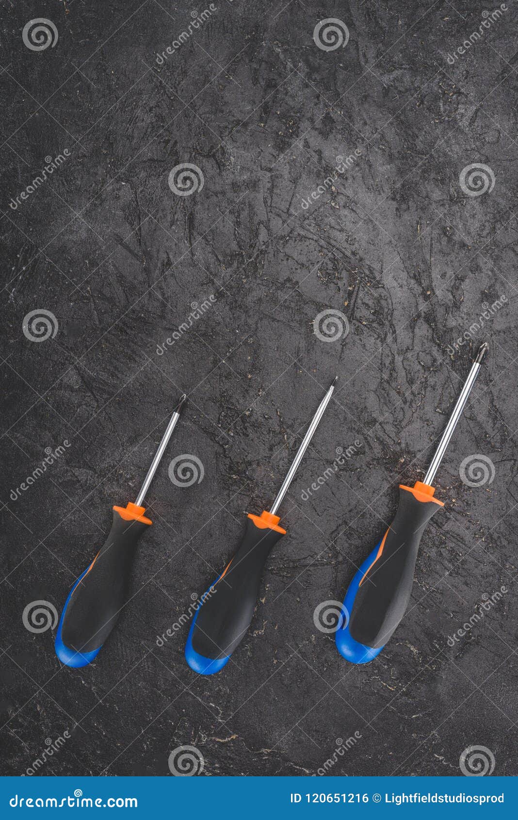 Top View of Three Screwdrivers Placed in Row on Black Stock Photo ...