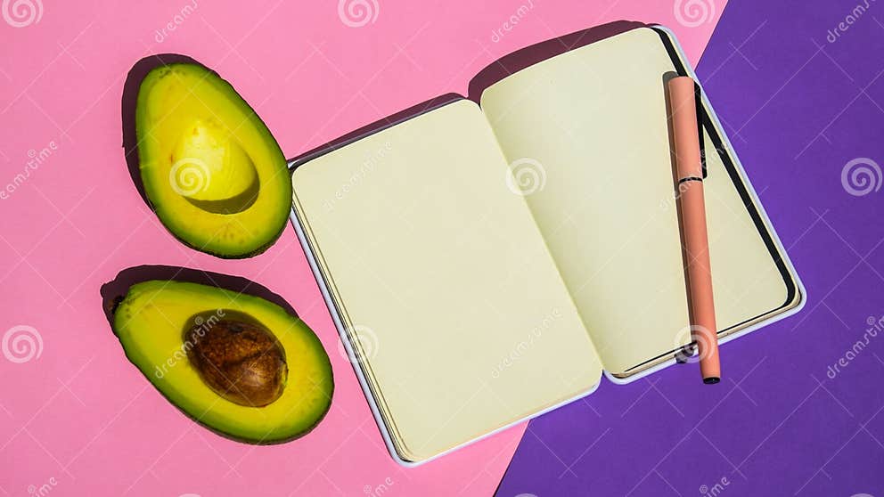 Top View. Top View an Empty Notepad and Sliced Avocado on a Pink ...