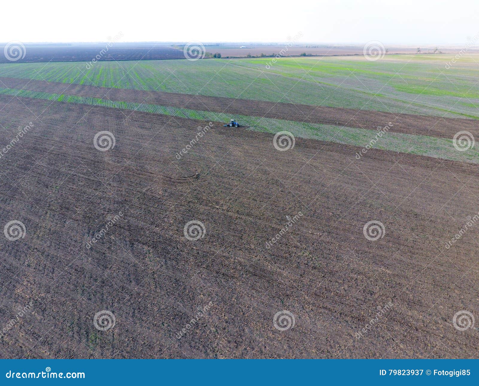 Top View of the Tractor that Plows the Field. Disking the Soil Stock ...