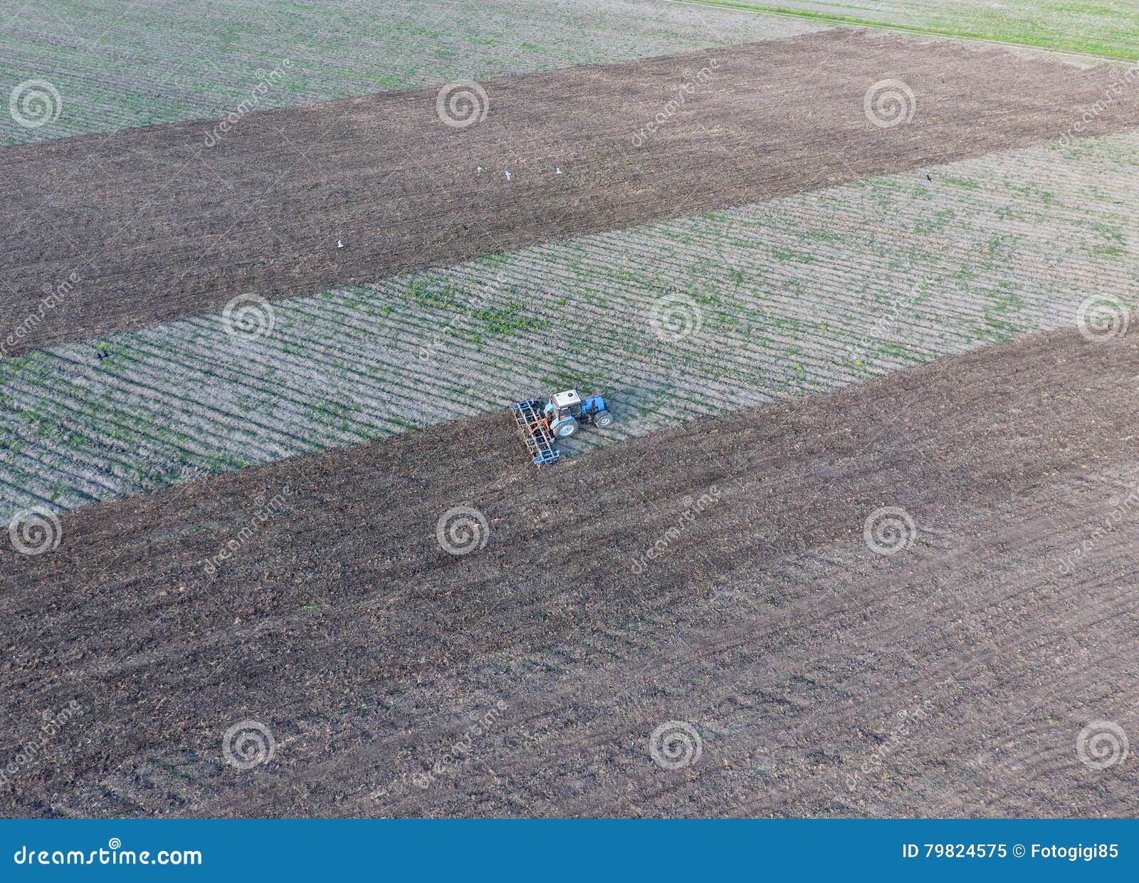 Top View of the Tractor that Plows the Field. Disking the Soil Stock ...