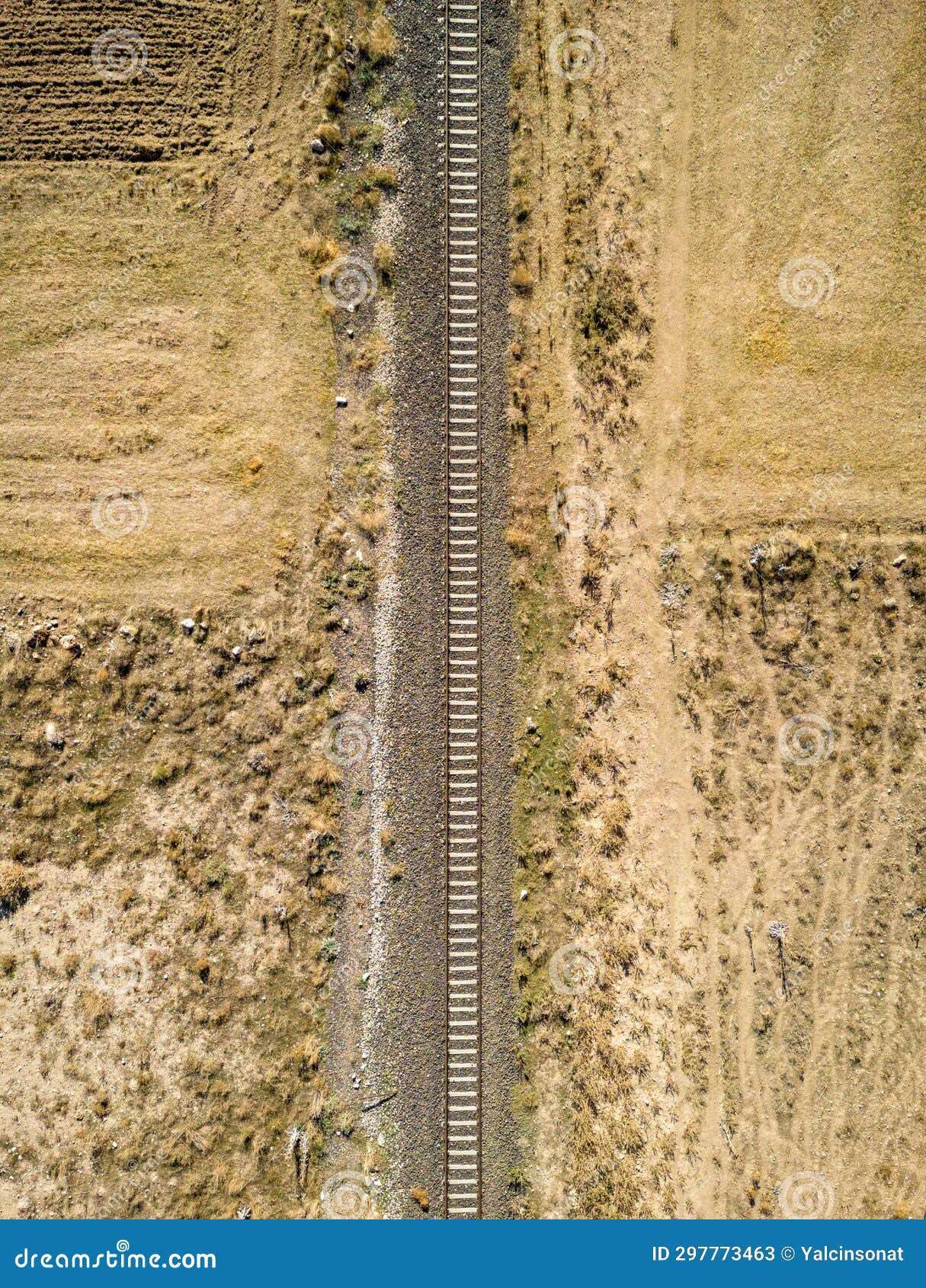 Top View of the Train Track Passing through the Arid Land, Taken with a ...