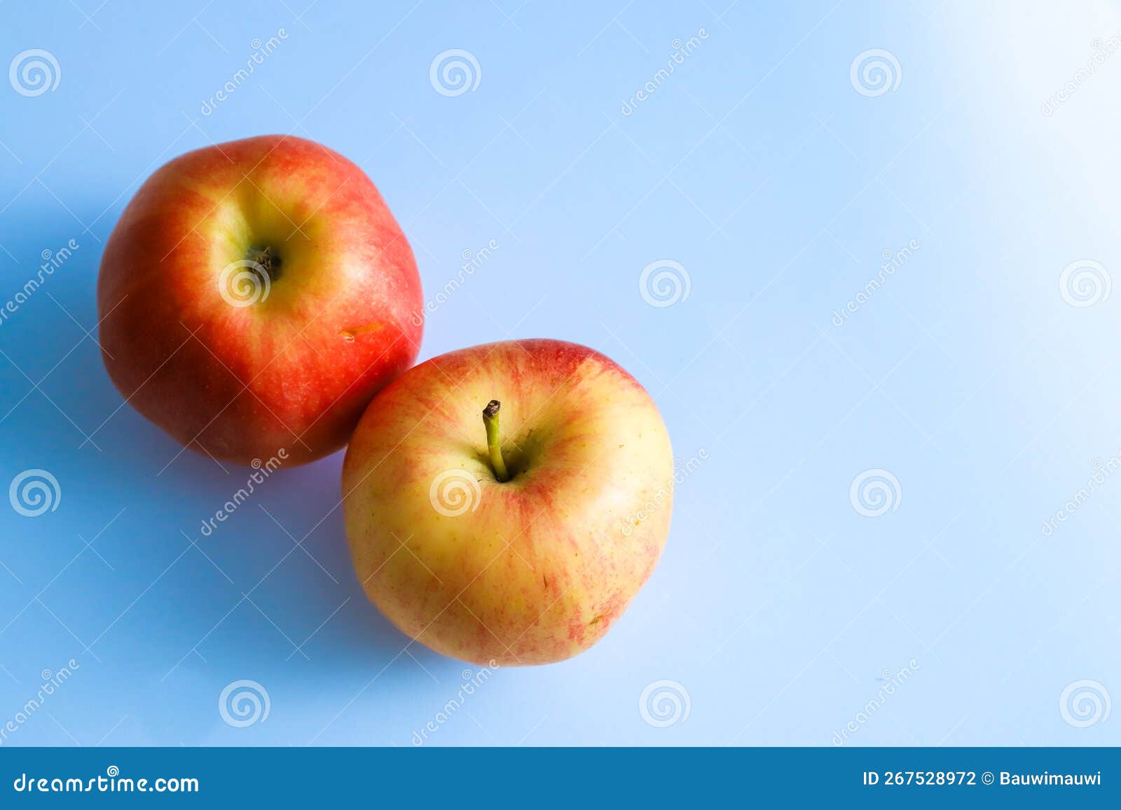 Top View of Two Apples on Blue Background with Copy Space Stock Photo ...