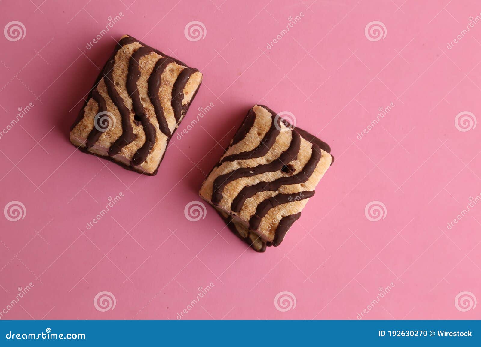 Top View of Two Chocolate Biscuits Isolated on a Pink Background Stock ...