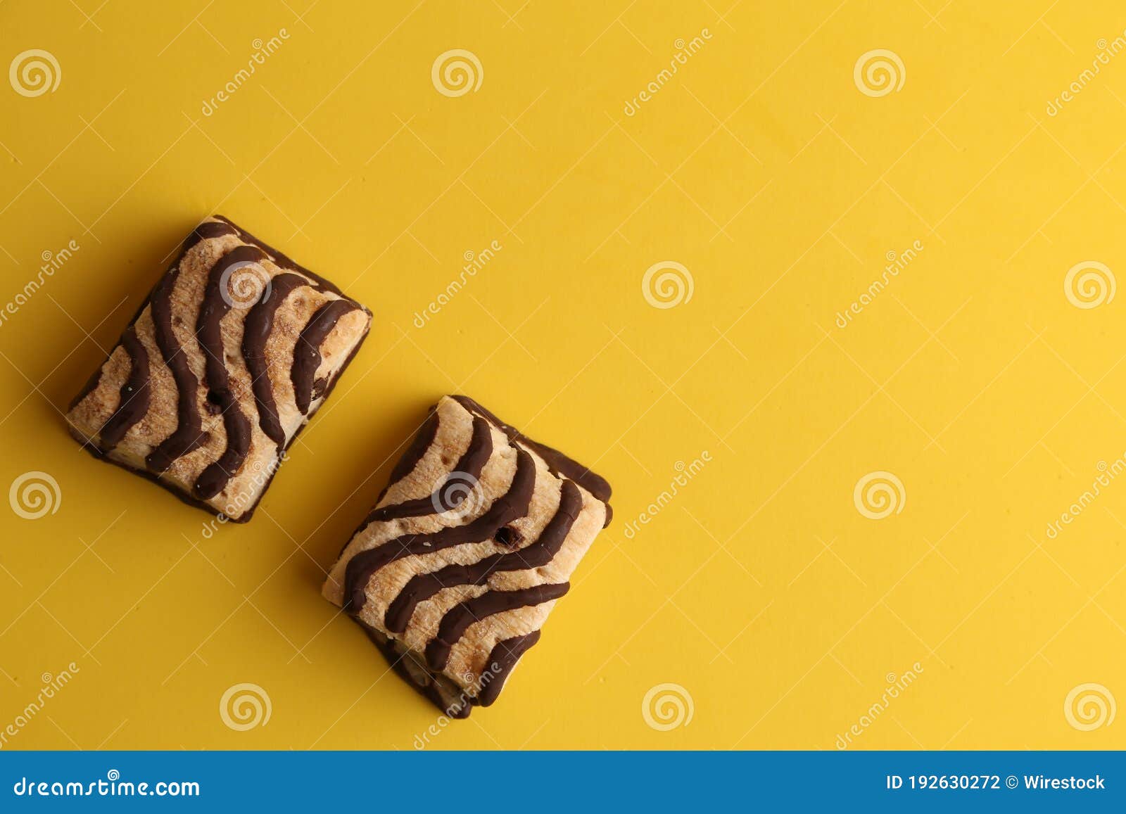 Top View of Two Delicious Biscuits on a Bright Yellow Surface Stock ...