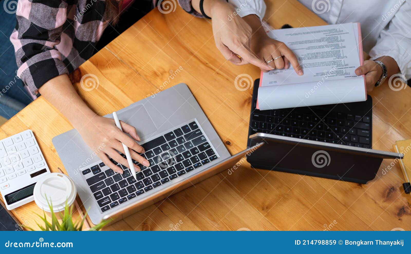 Top View of Two Female Students Doing Group Assignment Together with ...