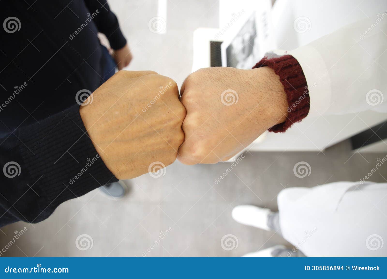Top View of Two Men Greeting Each Other Against a Backdrop of a ... Top View of Two Men Greeting Each Other Against a Backdrop of a ...