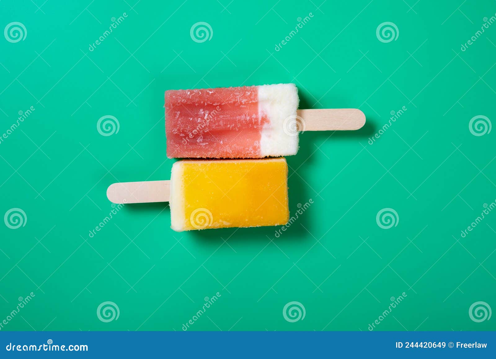 Two Vibrant Color Popsicles on Green Background Stock Image - Image of ...