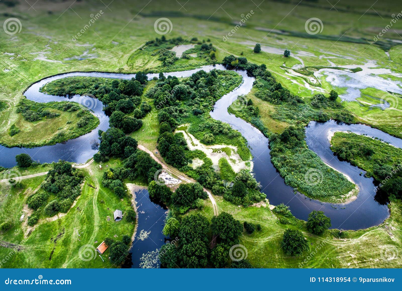Top View of the Valley of a Meandering River among Green Fields Stock ...