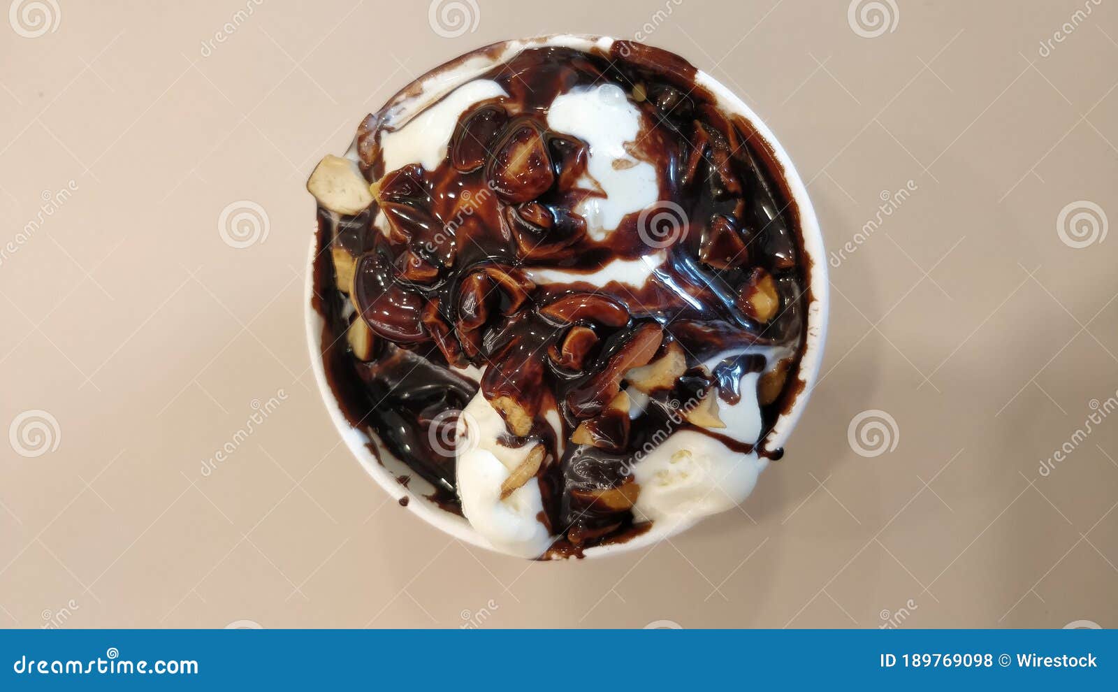 Top View of Vanilla Ice Cream with Chocolate and Nuts Toppings on a ...