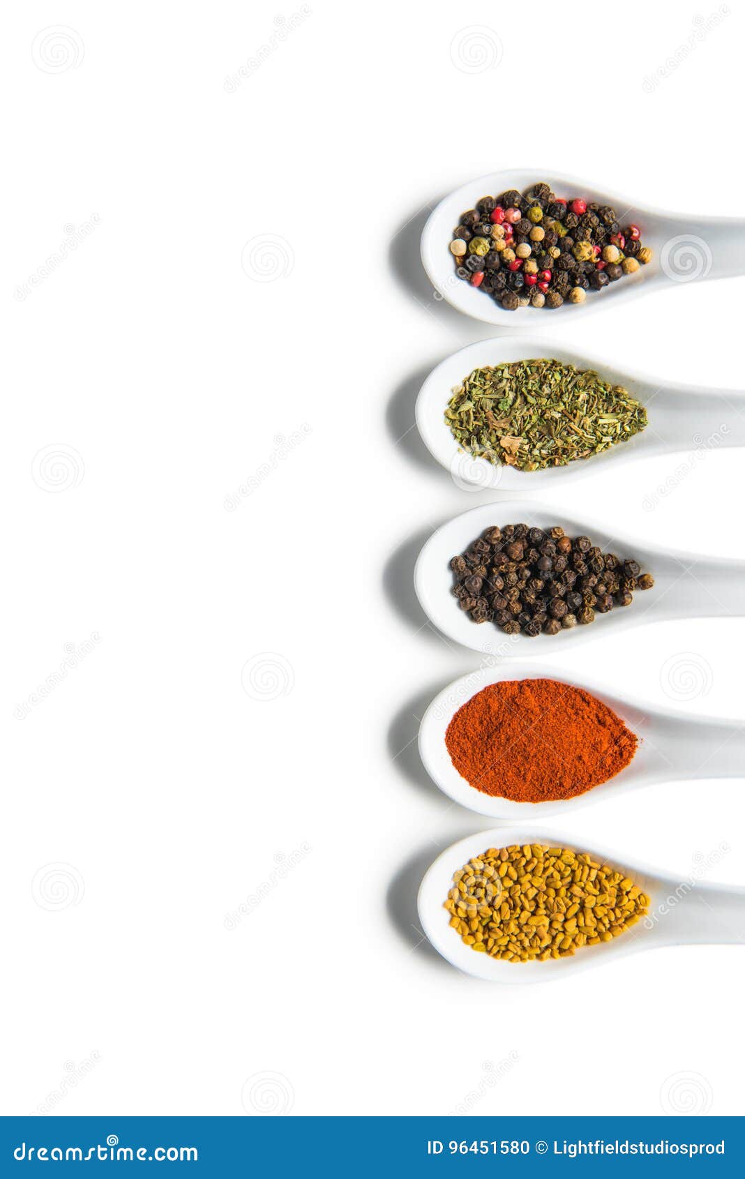 Top View of Various Dried Seasonings in White Ceramic Spoons Stock ...