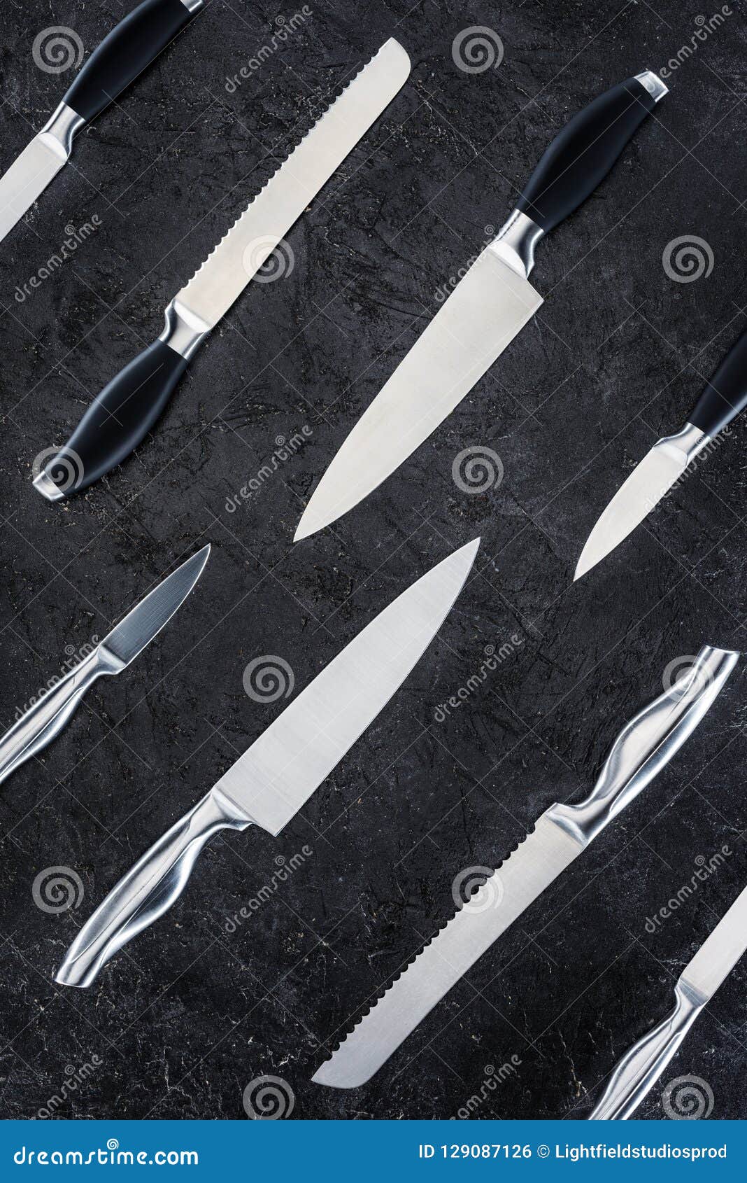Top View of Various Kitchen Knives Arranged on Black Surface Stock ...