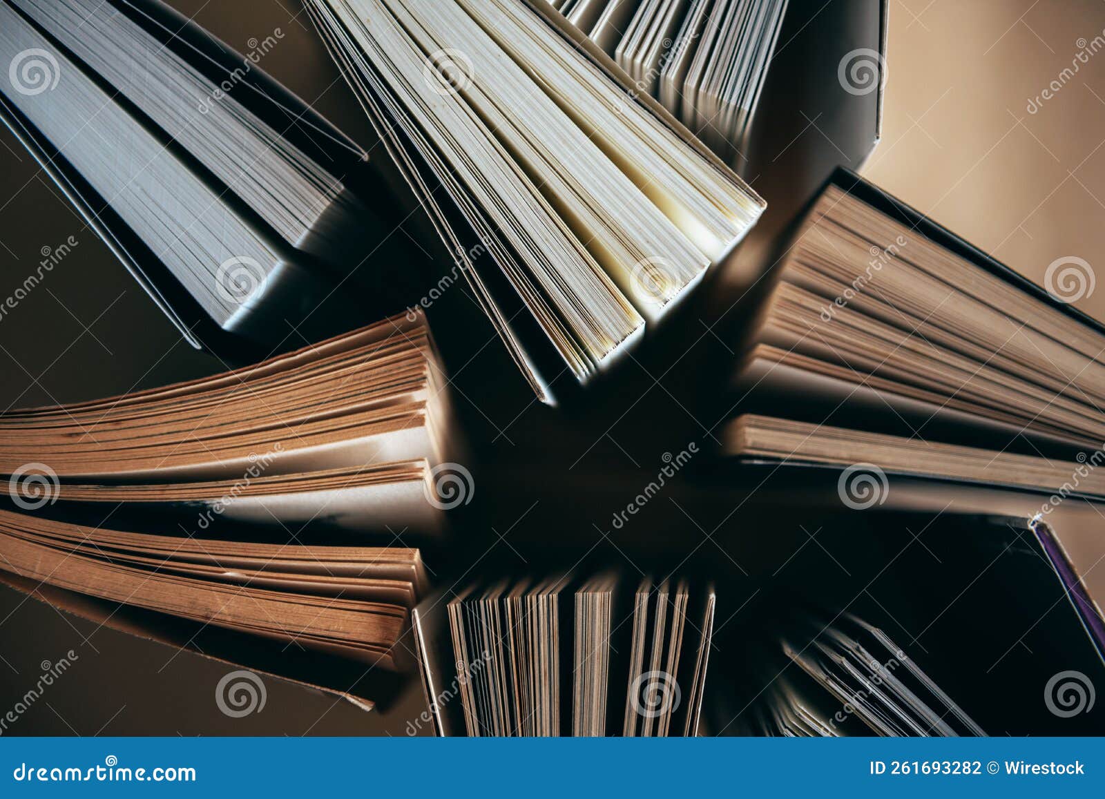 Top View of Vintage Half-open Books Stacked Vertically, Symbolizing the ... Top View of Vintage Half-open Books Stacked Vertically, Symbolizing the ...
