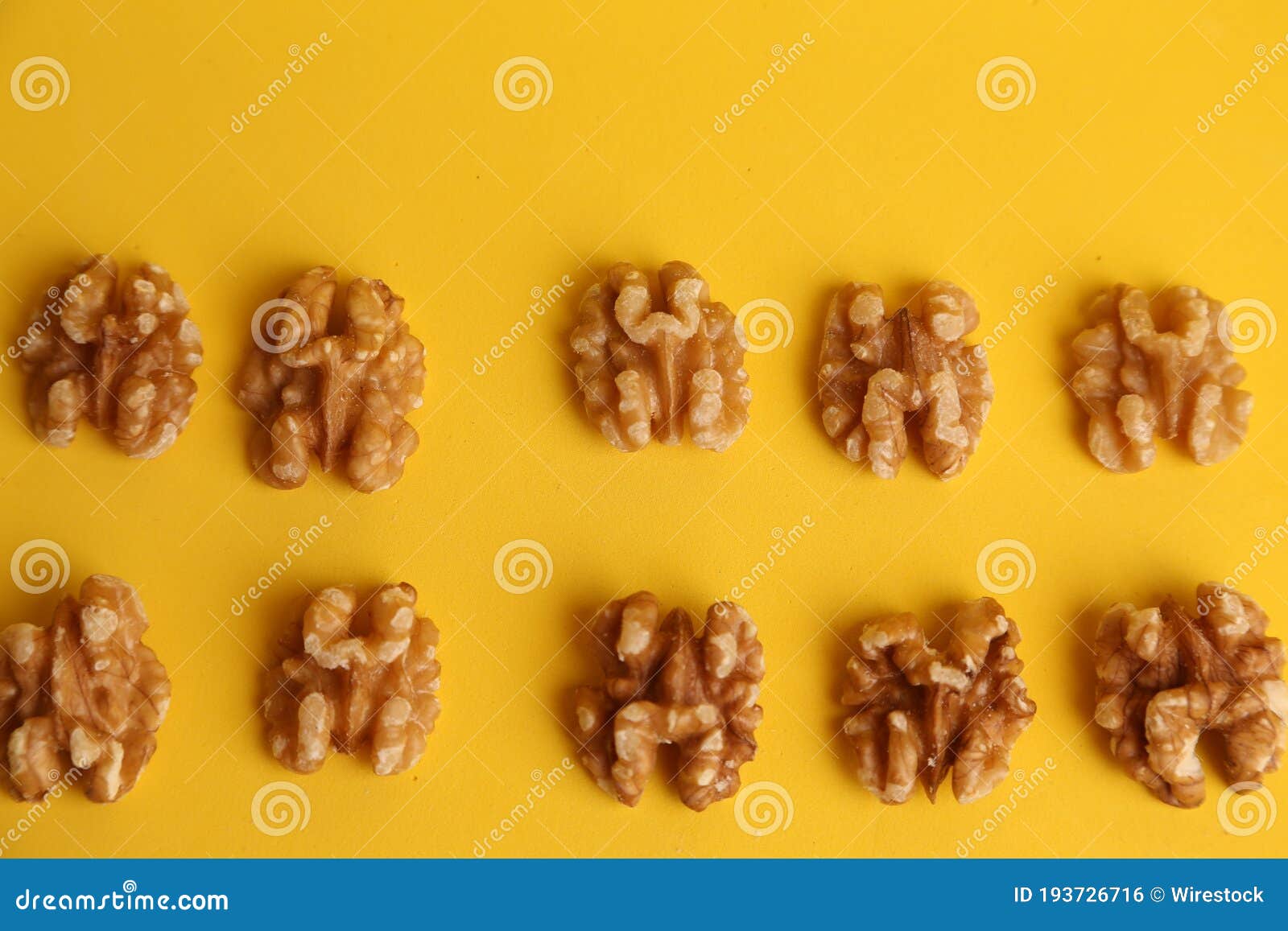 Top View of Walnut Kernels Arranged Orderly and Neatly on a Yellow ...