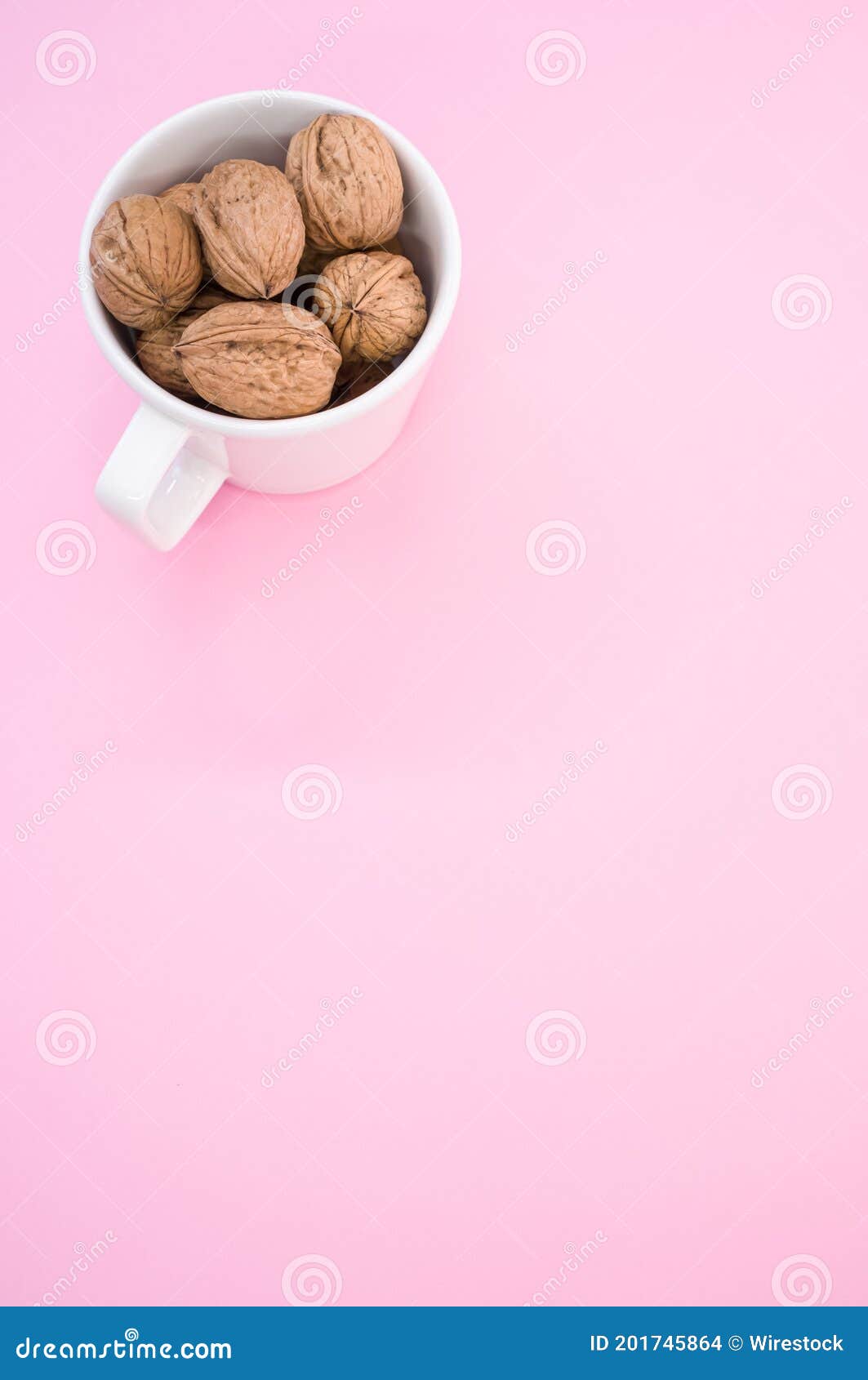 Top View of the Walnuts in the Cup on the Pink Surface - Space for Text ...