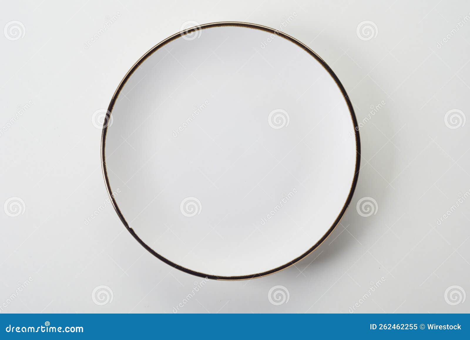 Top View of a White Ceramic Flat Plate with a Black Rim on a White ...