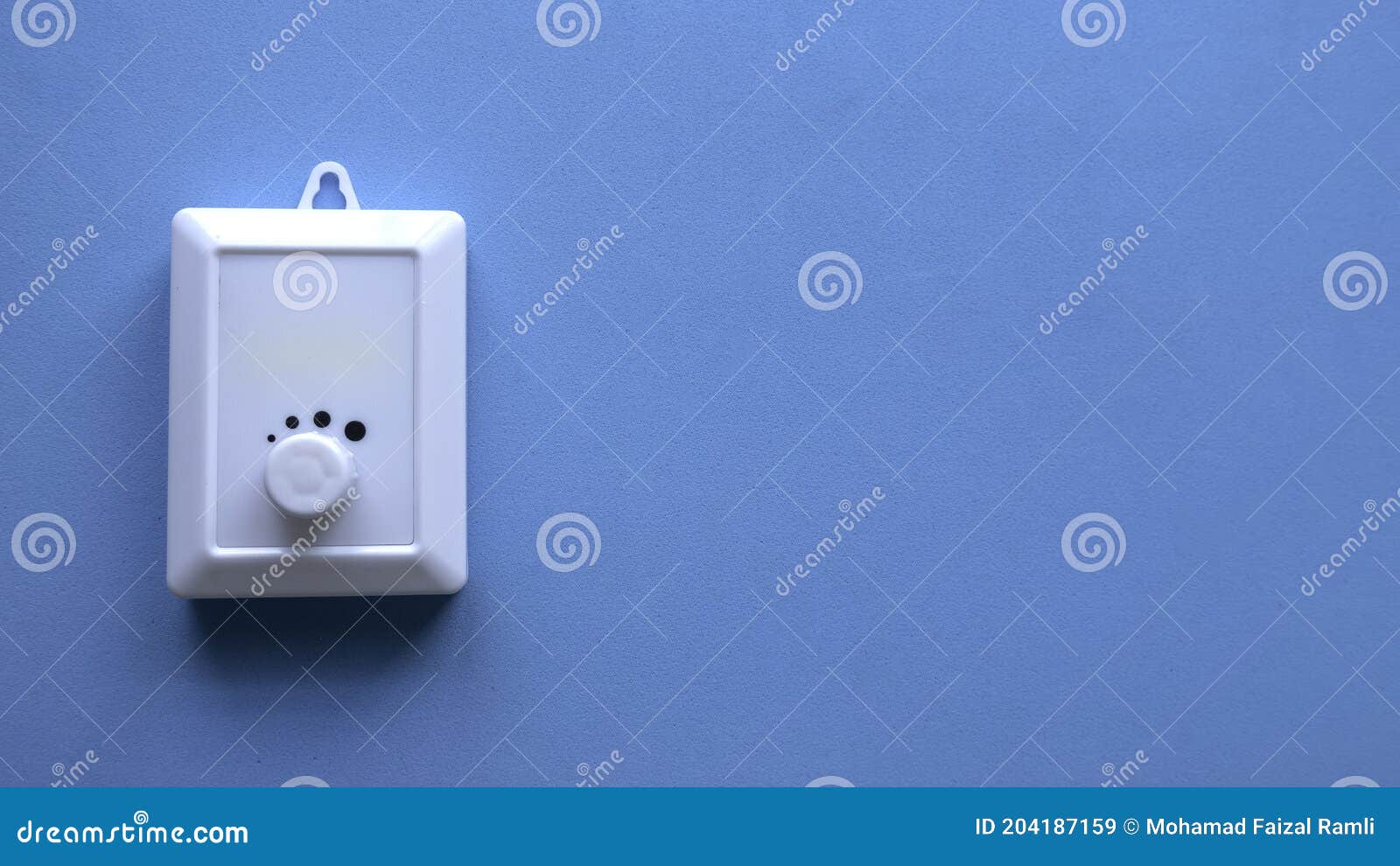 Top View of a White Dimming Light on a Blue Background with Copy Space ...