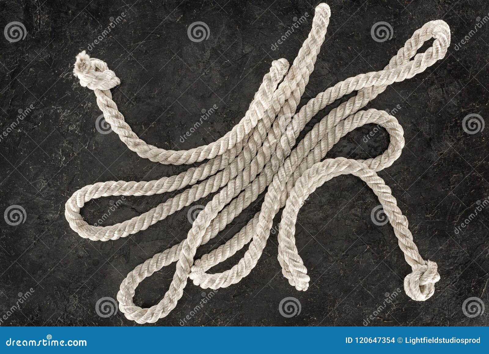 Top View of White Nautical Rope with Knots on Dark Stock Photo - Image ...