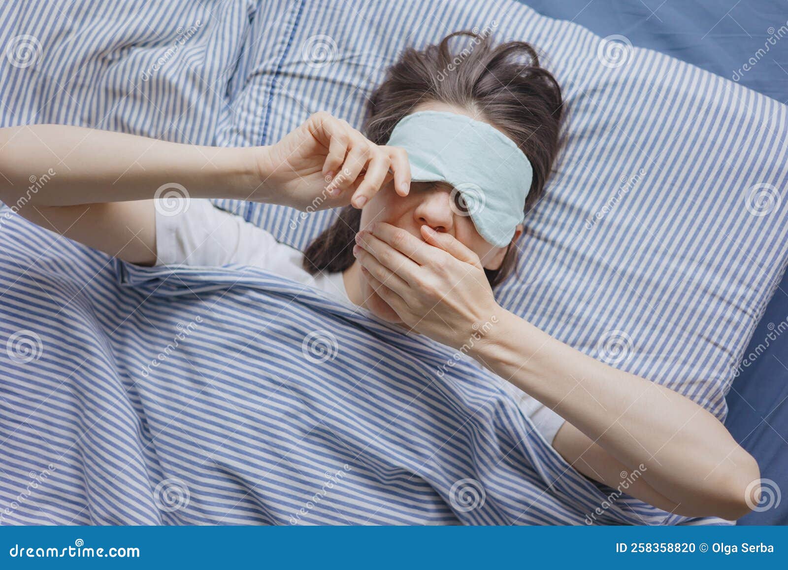 Top View Of A Woman In Bed Wearing A Sleep Mask A Happy European Woman