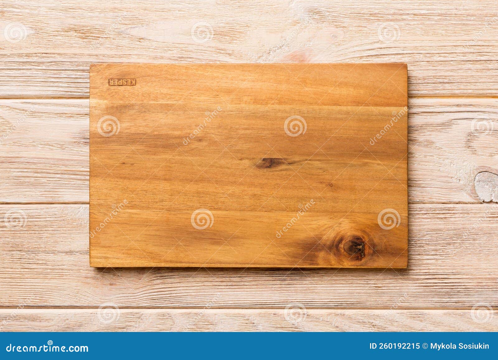 Top View of Wooden Cutting Board on Wooden Background. Empty Space for ...