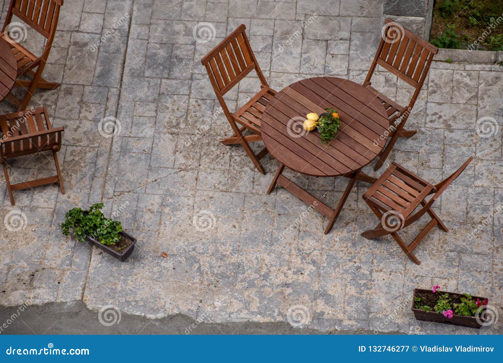 Top View of a Wooden Restaurant Table with Chairs, Adorned with Stock ...