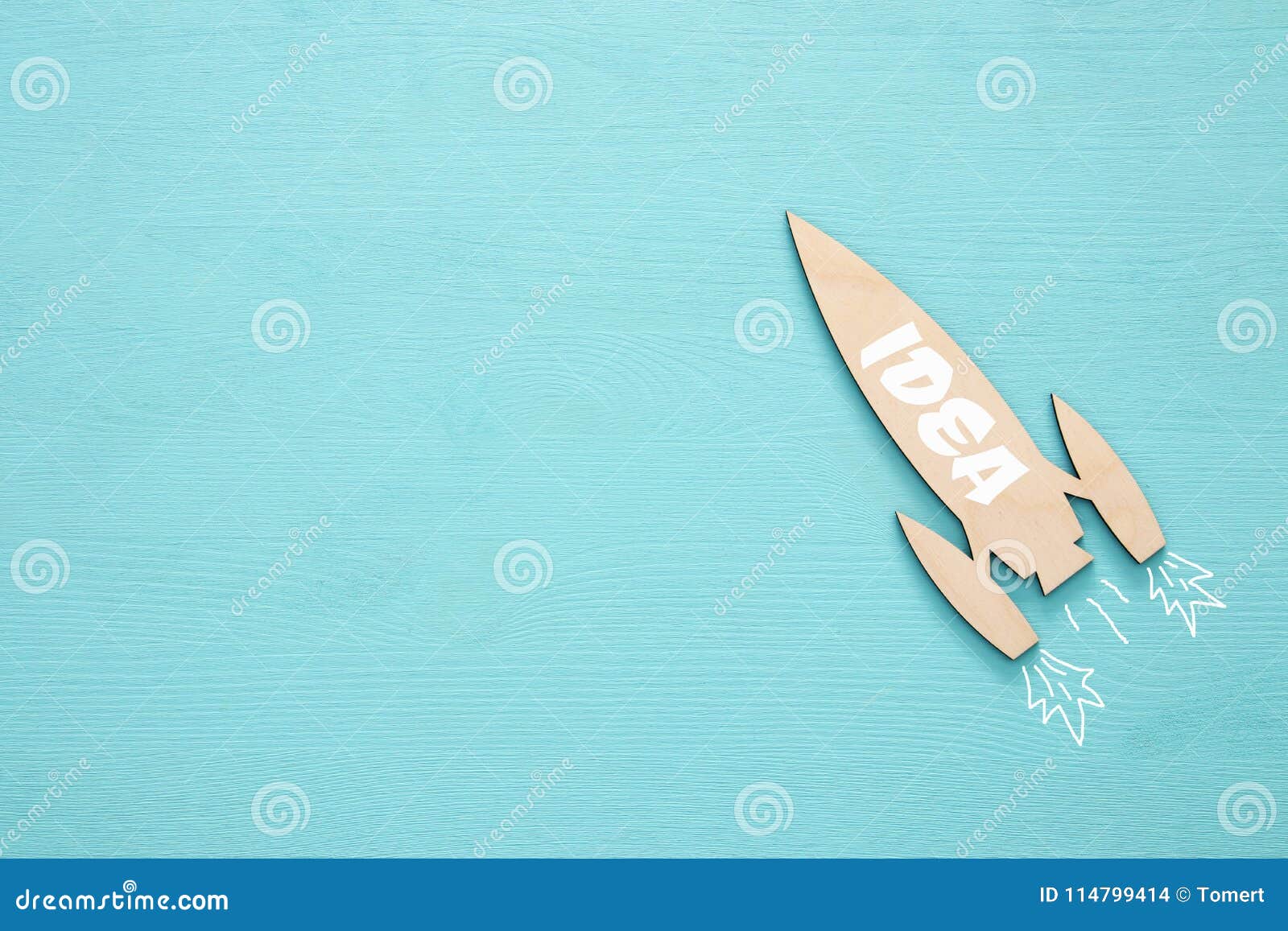 Top View of Wooden Rocket with Word - Idea - Over Blue Background ...