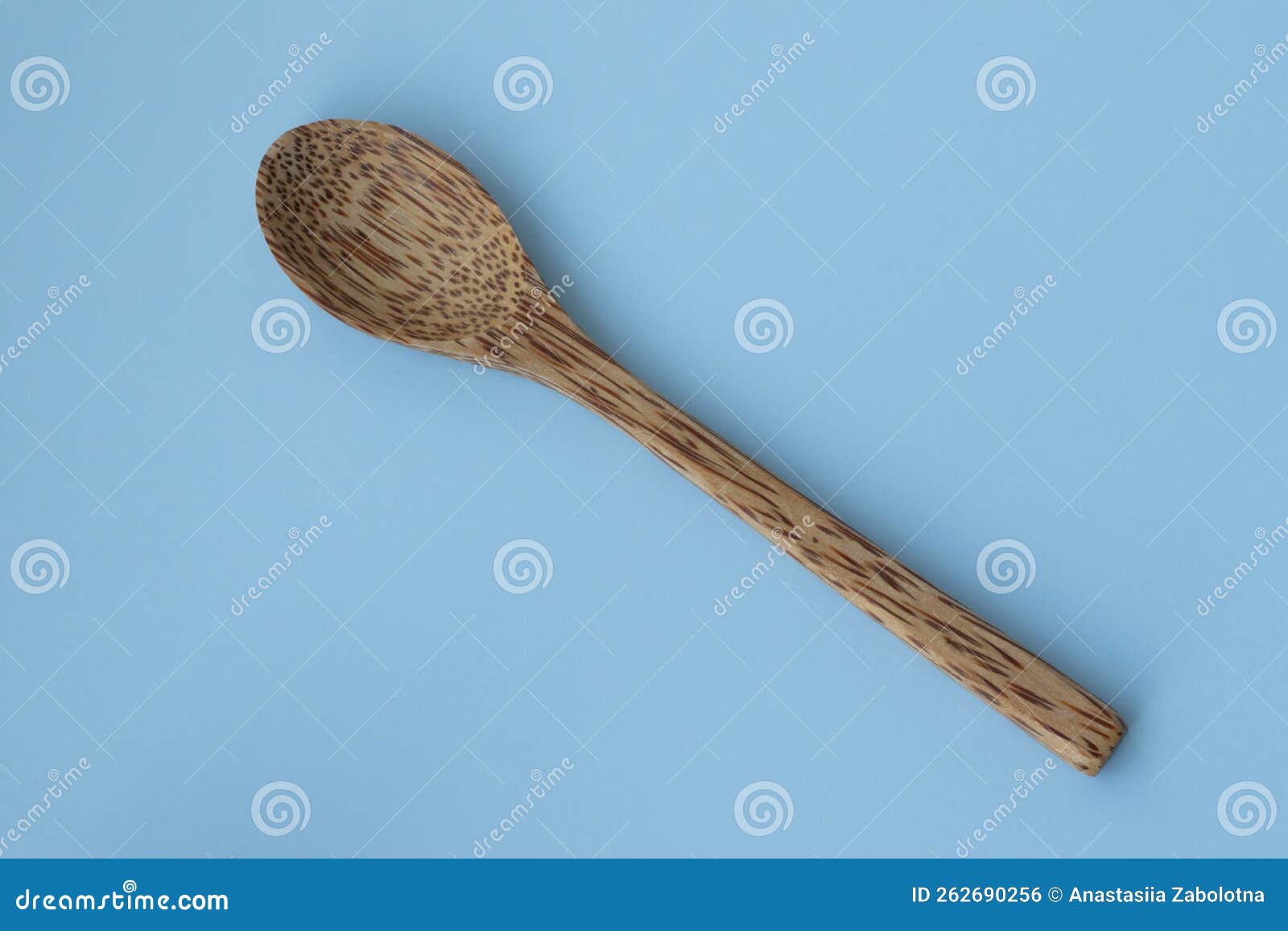 Top View of a Wooden Spoon with Texture on a Blue Background Stock ...