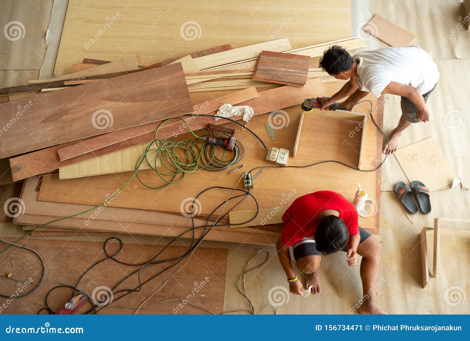 Top View Workers Working At The Construction Site. Laborer Carries The ...