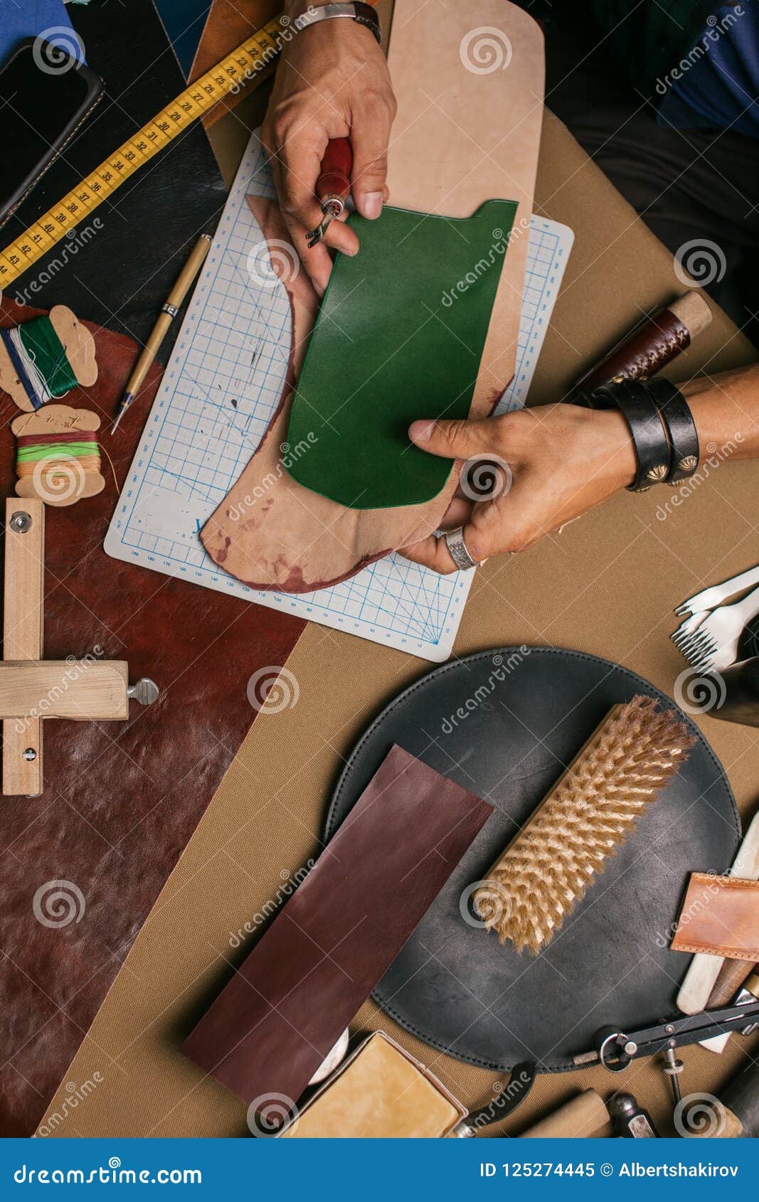 Close Up of a Shoemaker Working with Leather Textile and Hammer at a ...